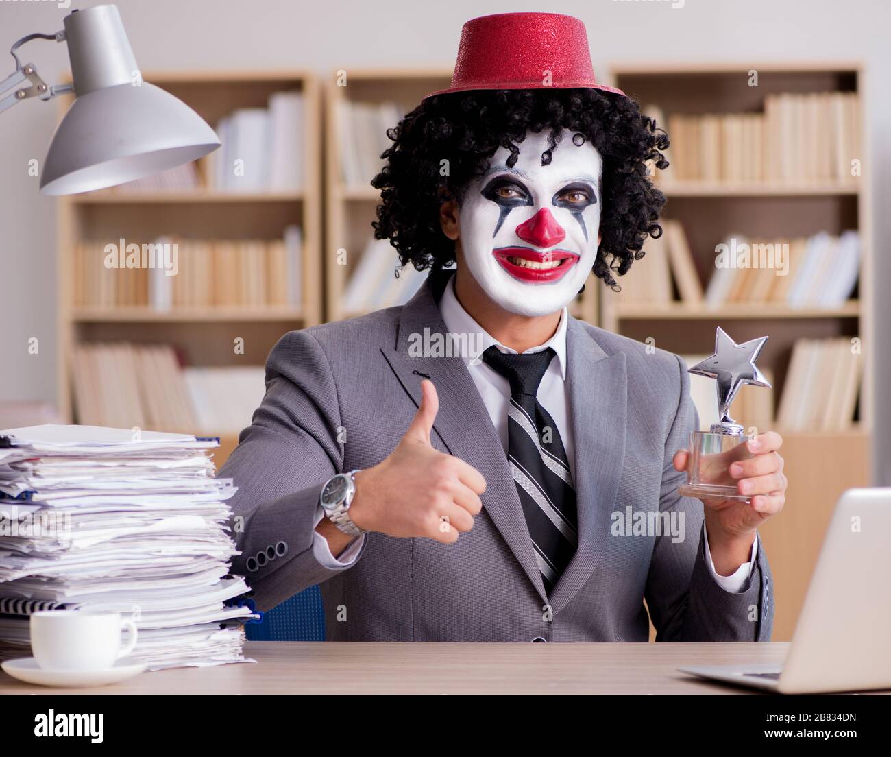The clown businessman working in the office Stock Photo - Alamy