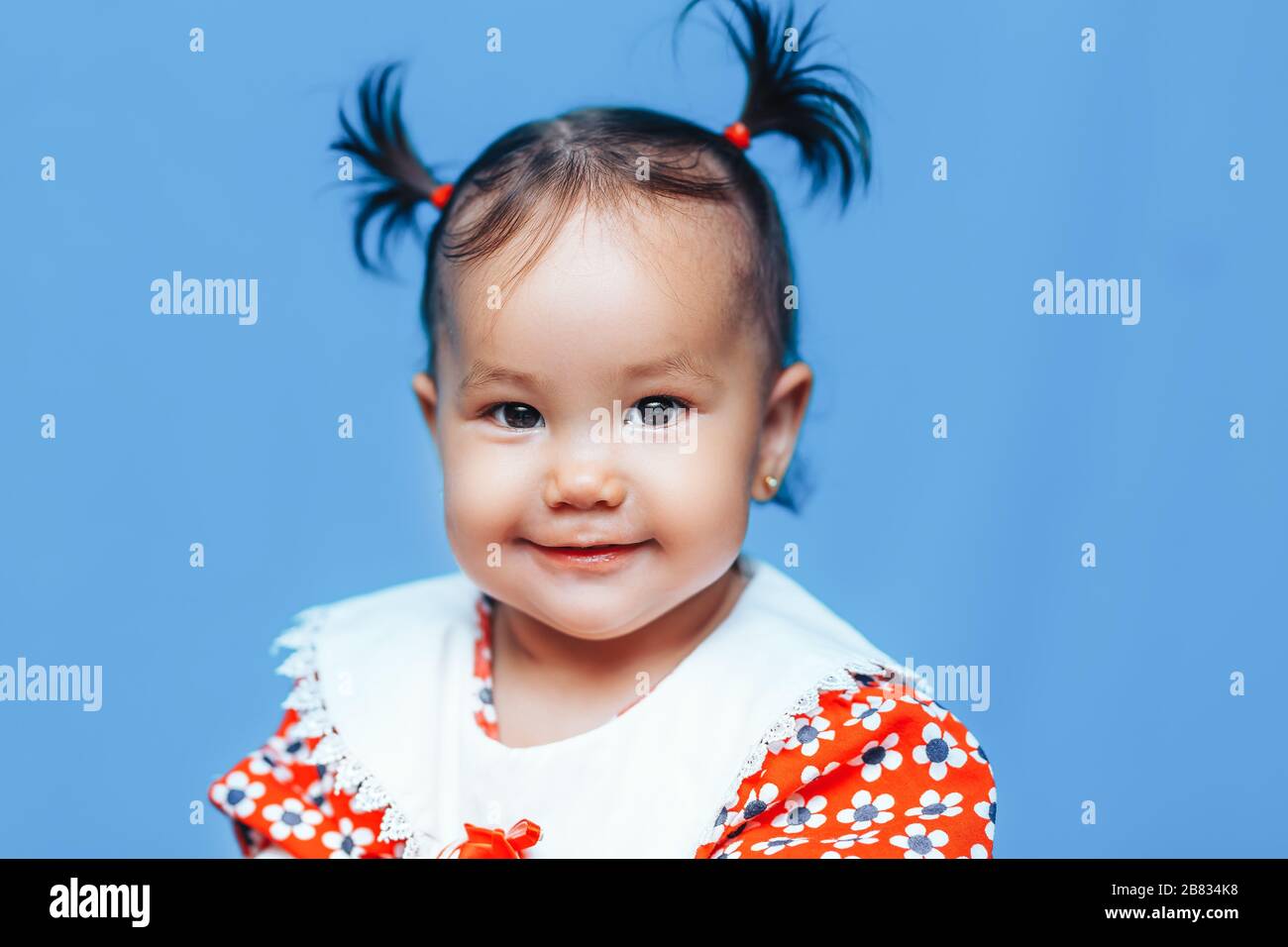 Cute one year old mixed race Asian Caucasian german girl wearing red ...