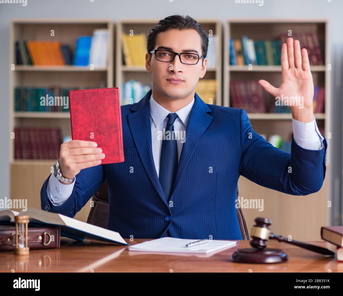 The handsome judge with gavel sitting in courtroom Stock Photo - Alamy
