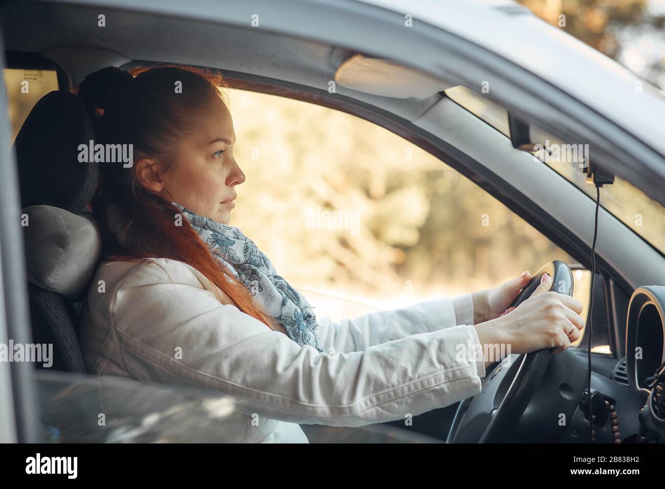 young beautiful woman driving a car Stock Photo - Alamy