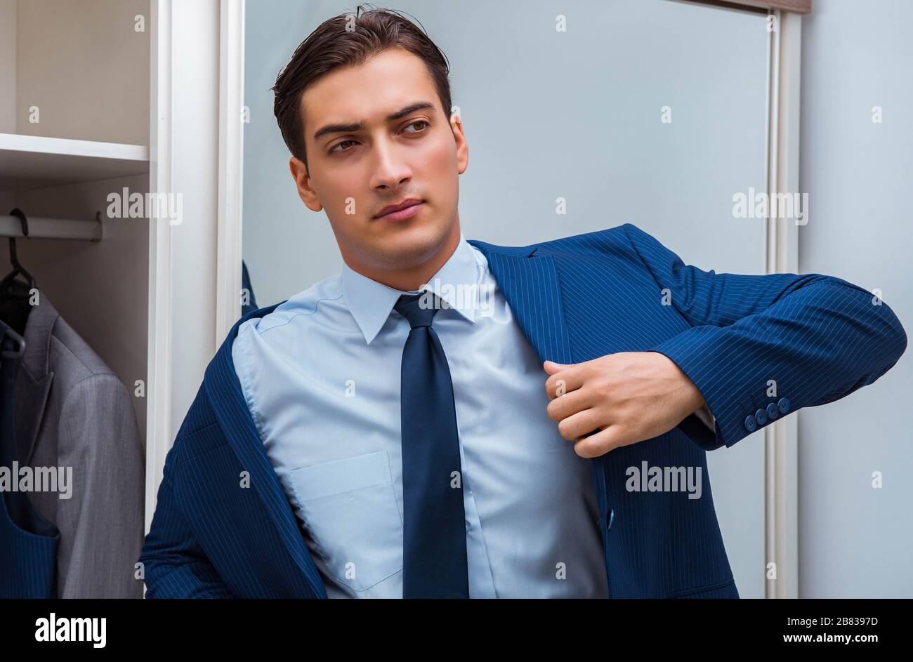 The businessman dressing up for work Stock Photo - Alamy