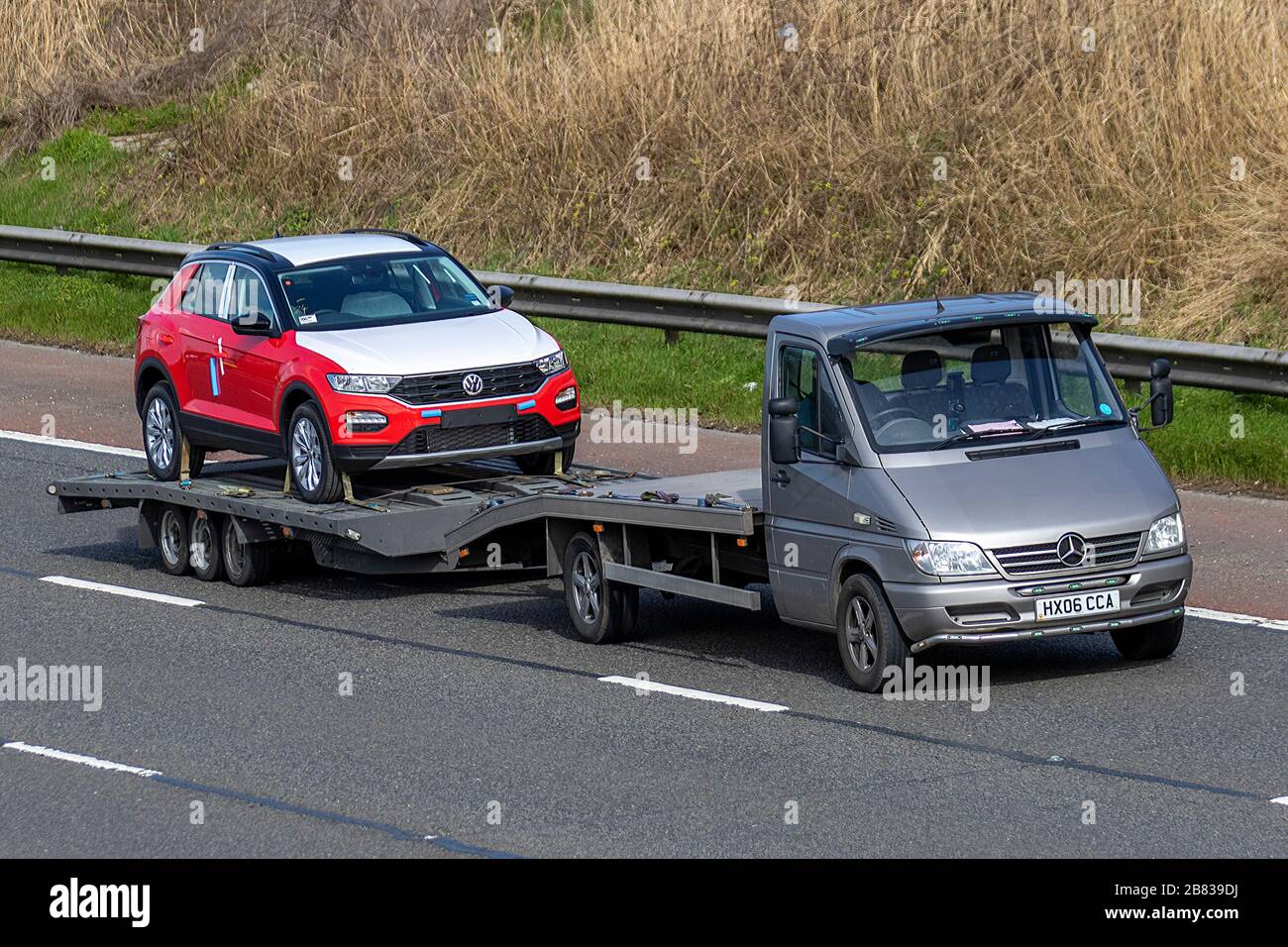 Custom red white VW Volkswagen on car trailer; UK vehicular traffic ...