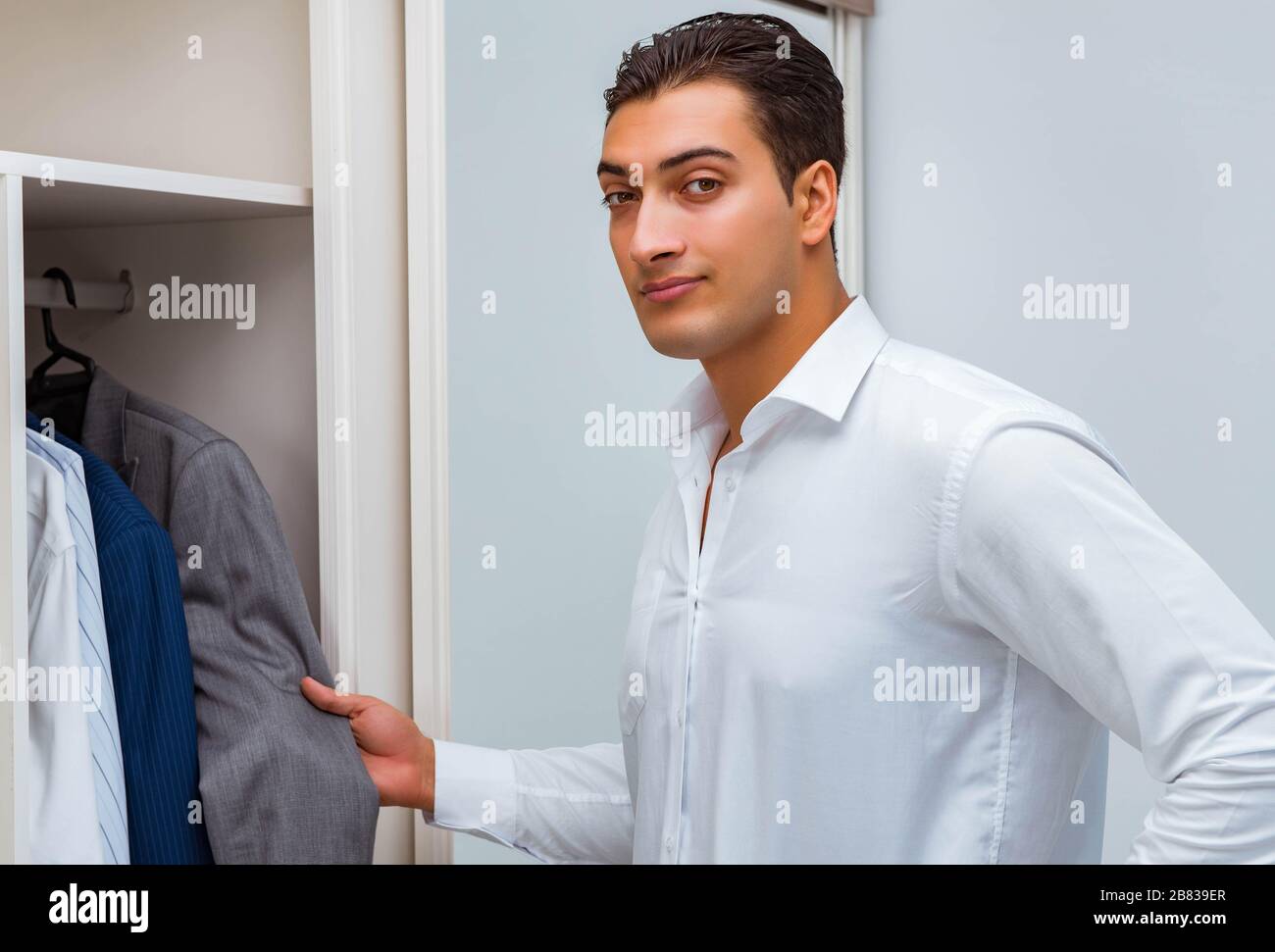 The businessman dressing up for work Stock Photo - Alamy