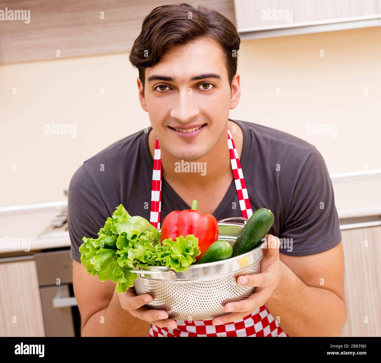 The man male cook preparing food in kitchen Stock Photo - Alamy