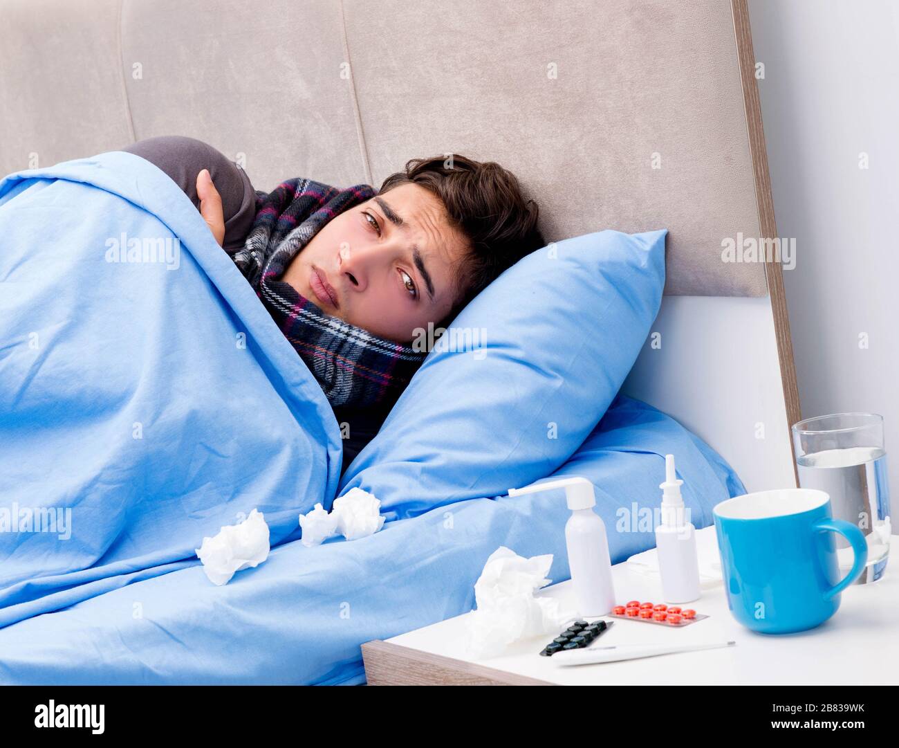 The sick ill man in the bed taking medicines and drugs Stock Photo - Alamy