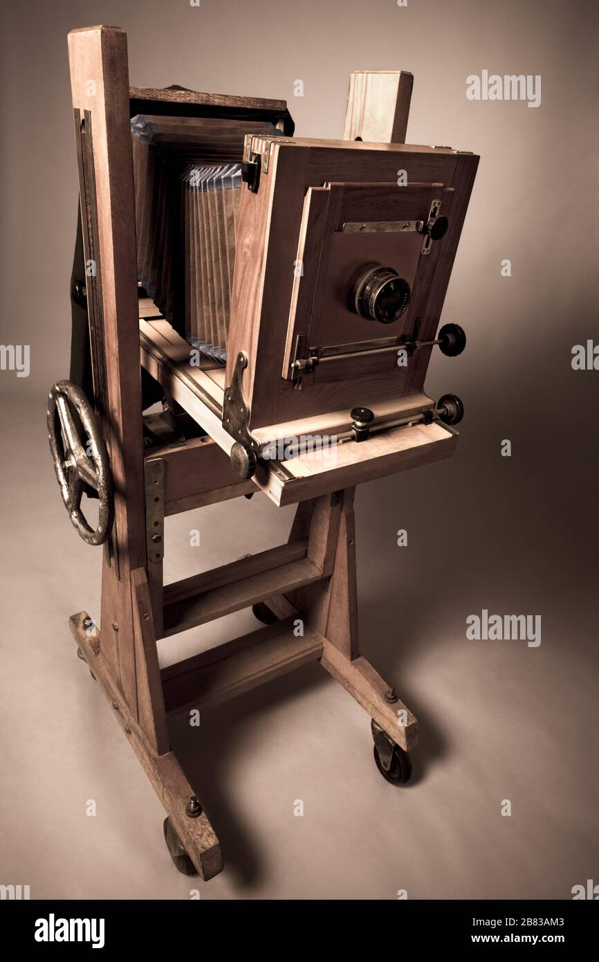 Close-up wooden vintage daguerreotype camera stands in studio. Concept ...