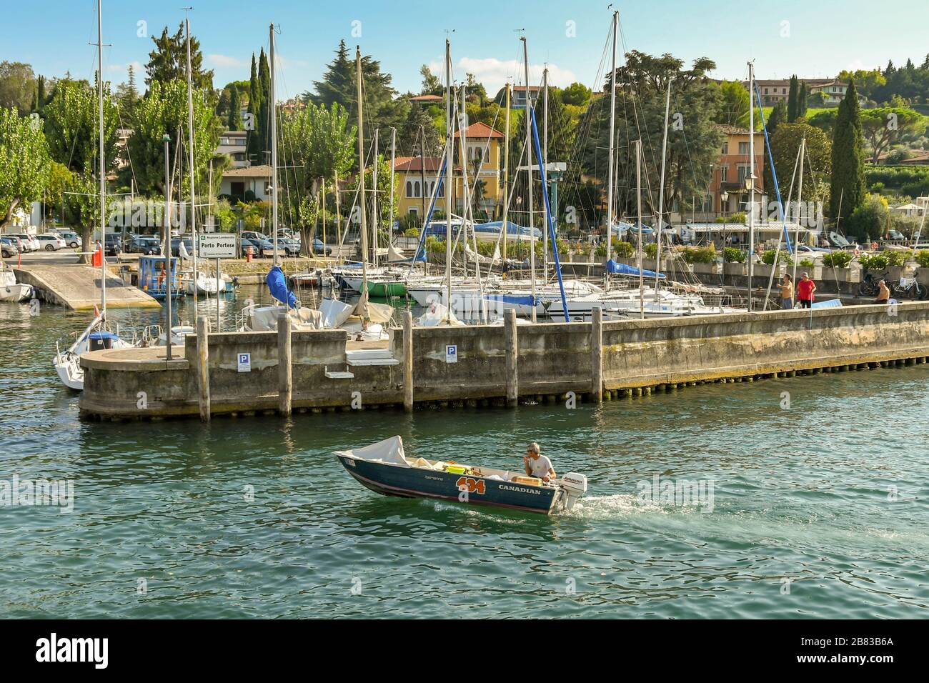 PORTESE, LAKE GARDA, ITALY - SEPTEMBER 2018: Small boat with outboard ...