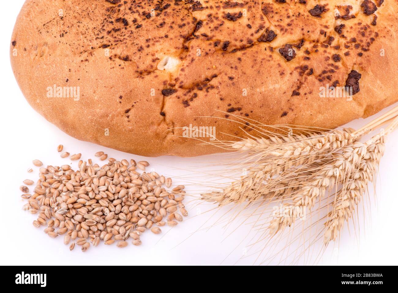flat loaf isolated on a white background decorated with wheat stalks ...