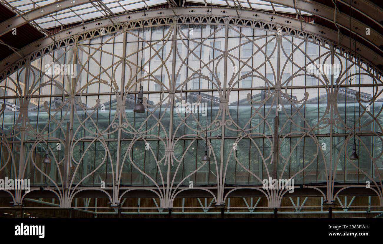 Arched window with wrought iron tracery at Paddington Station, a ...