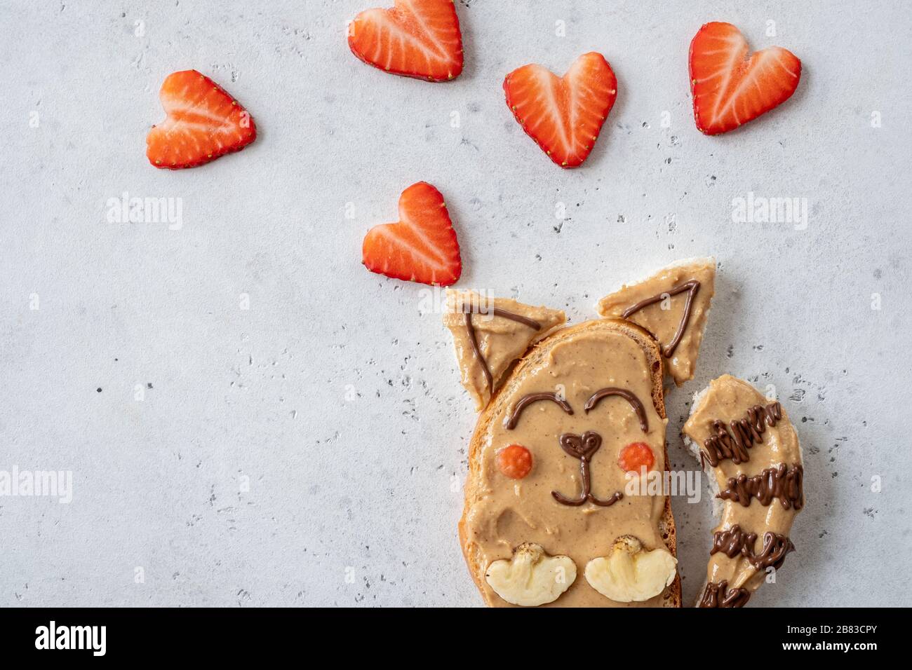 Funny cute cat sandwich with peanut butter, banana and strawberry for ...