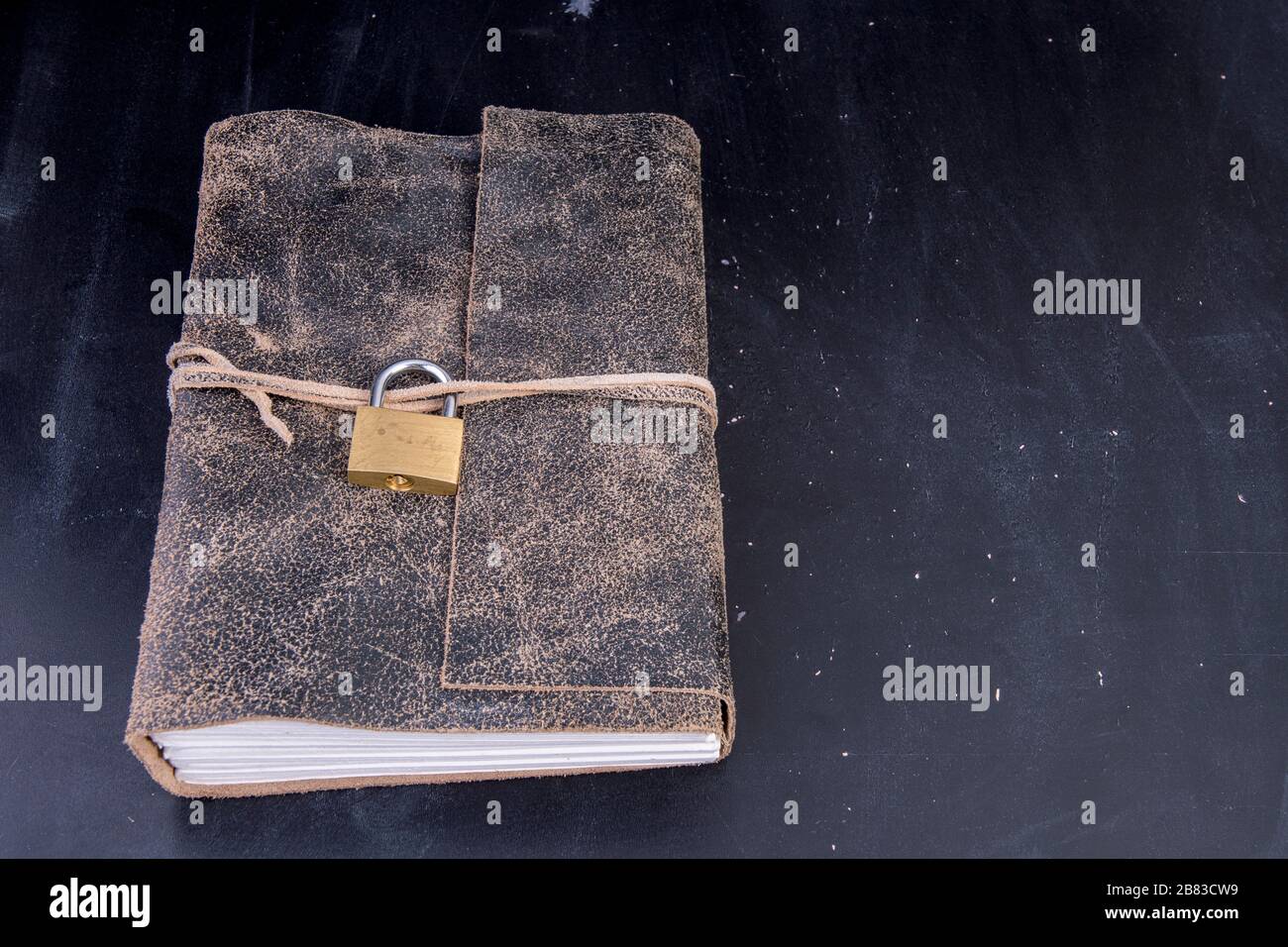 Diary in leather binding completed Stock Photo - Alamy