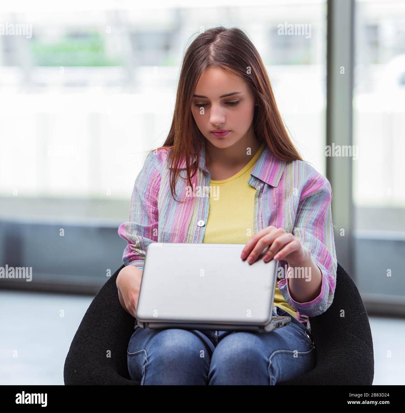 The young girl surfing internet on laptop Stock Photo - Alamy