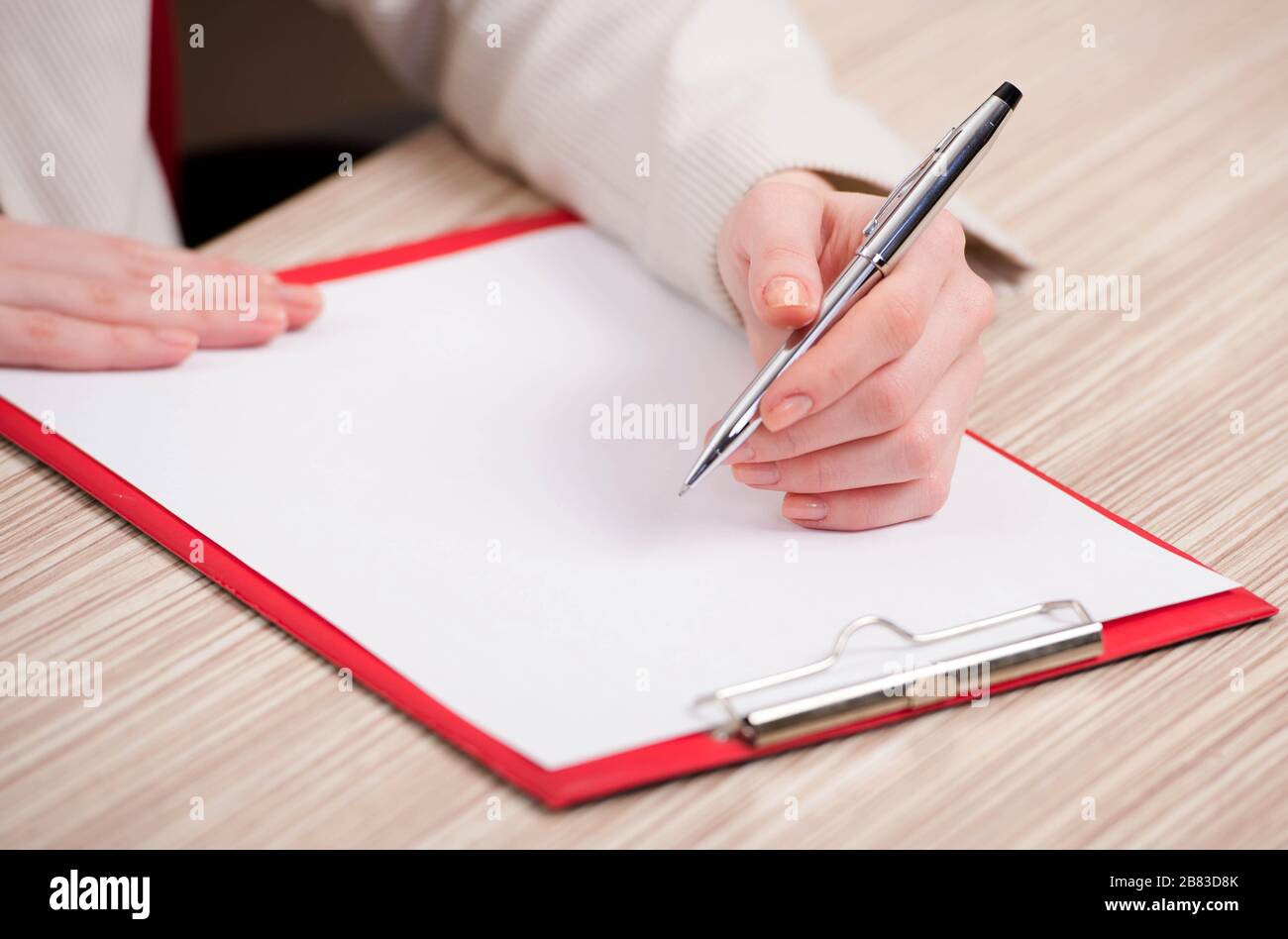 The hands taking notes in the pad Stock Photo - Alamy