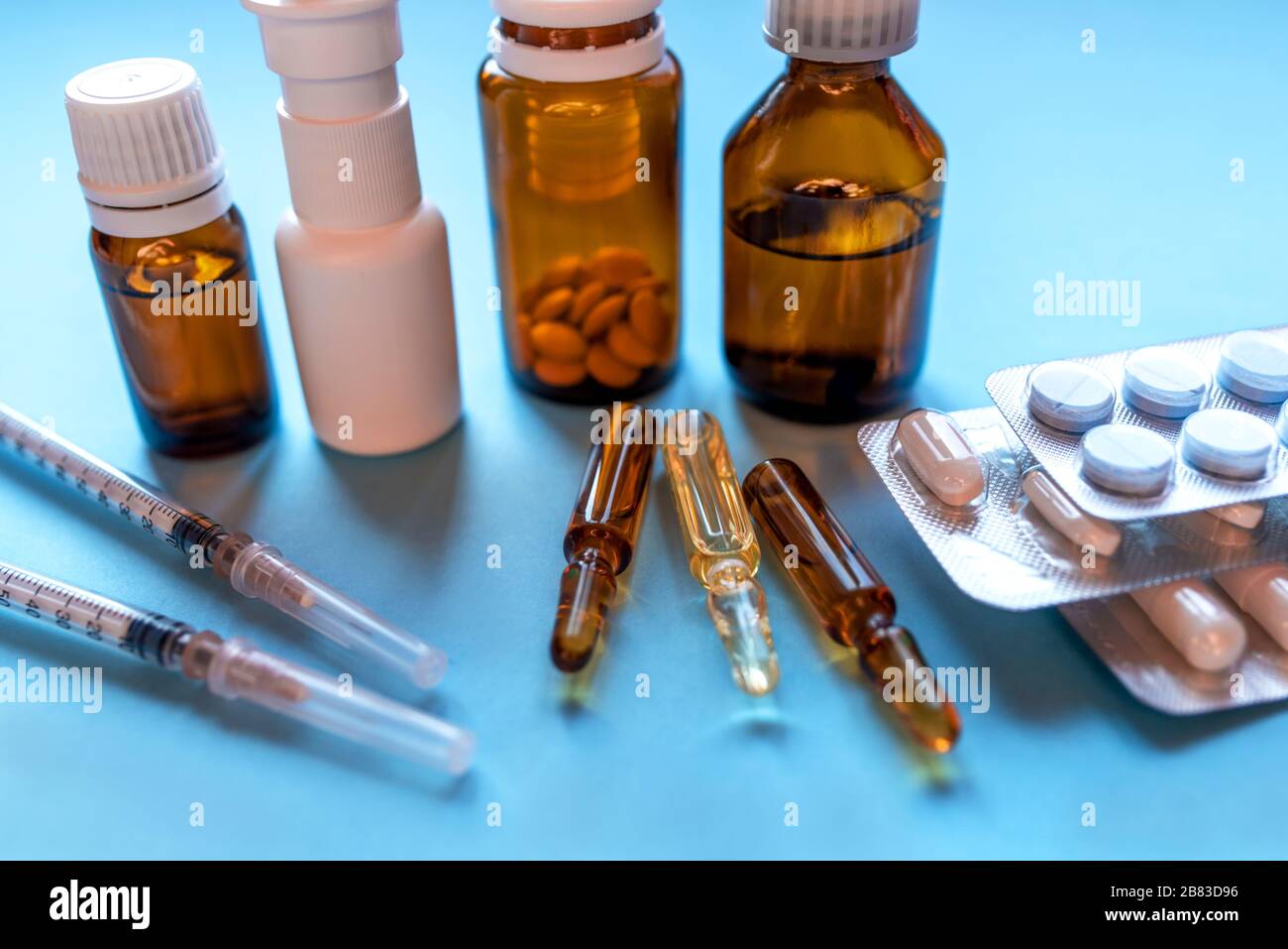 Tablets, pack of medicines with medicine bottles on a blue background ...