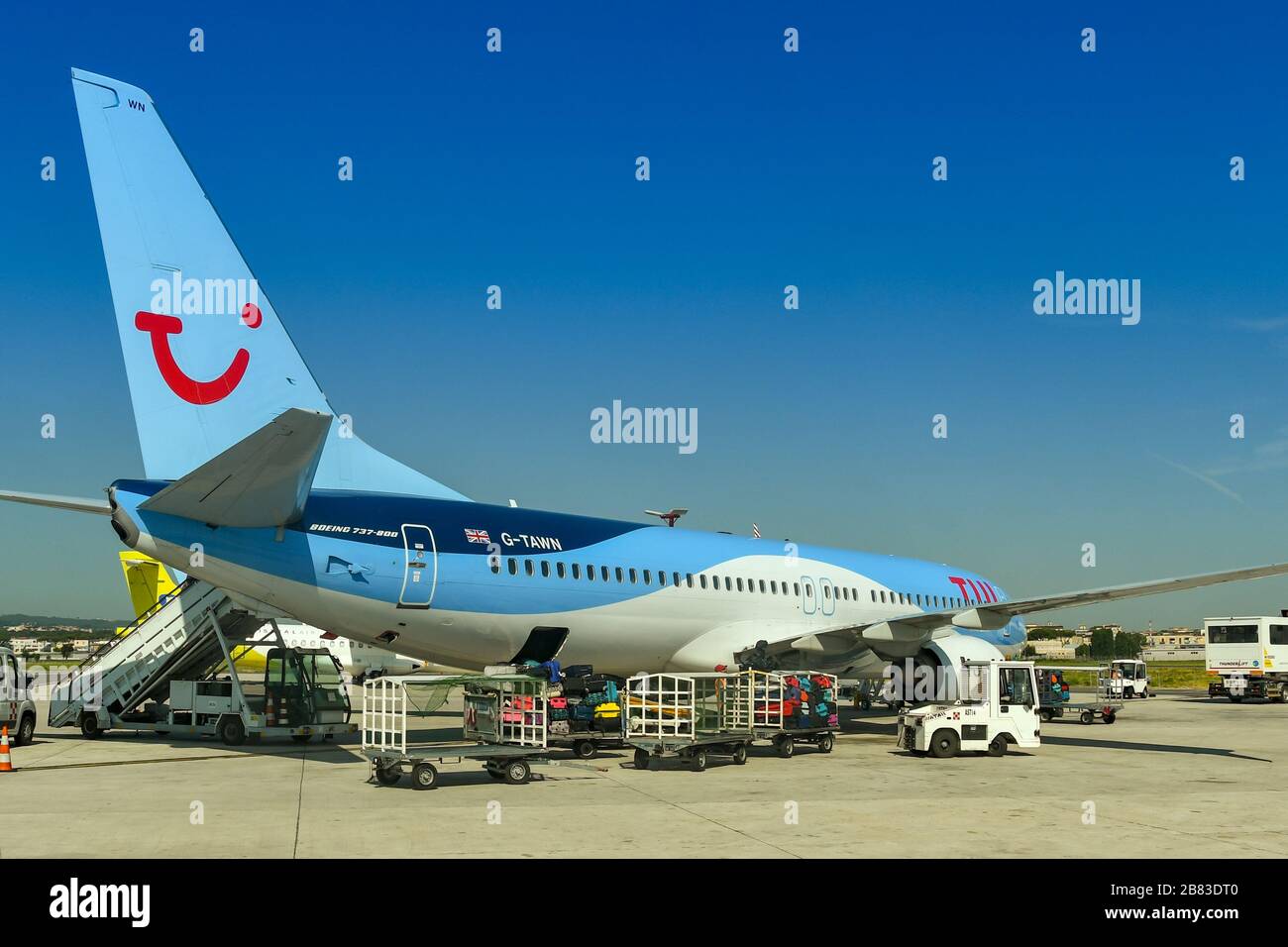 NAPLES, ITALY - AUGUST 2019: TUI Boeing 737 holiday jet surrounded by ...