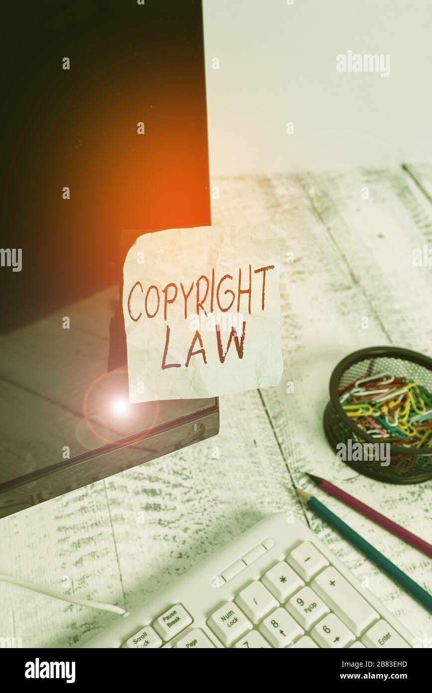 Writing note showing Copyright Law. Business concept for body of law ...