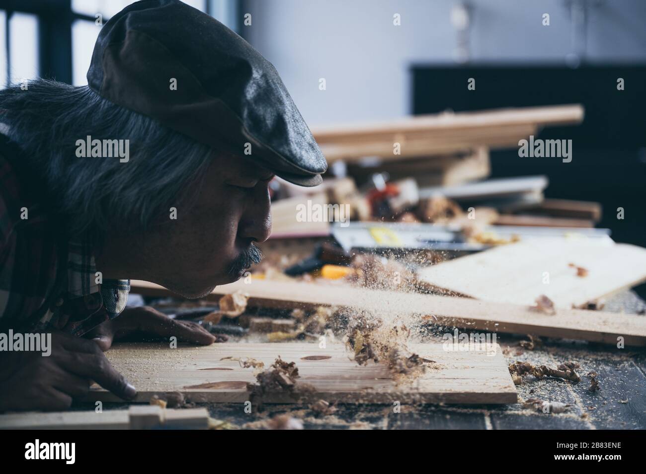 old carpenter man, wooden craftsman working with wood Stock Photo - Alamy