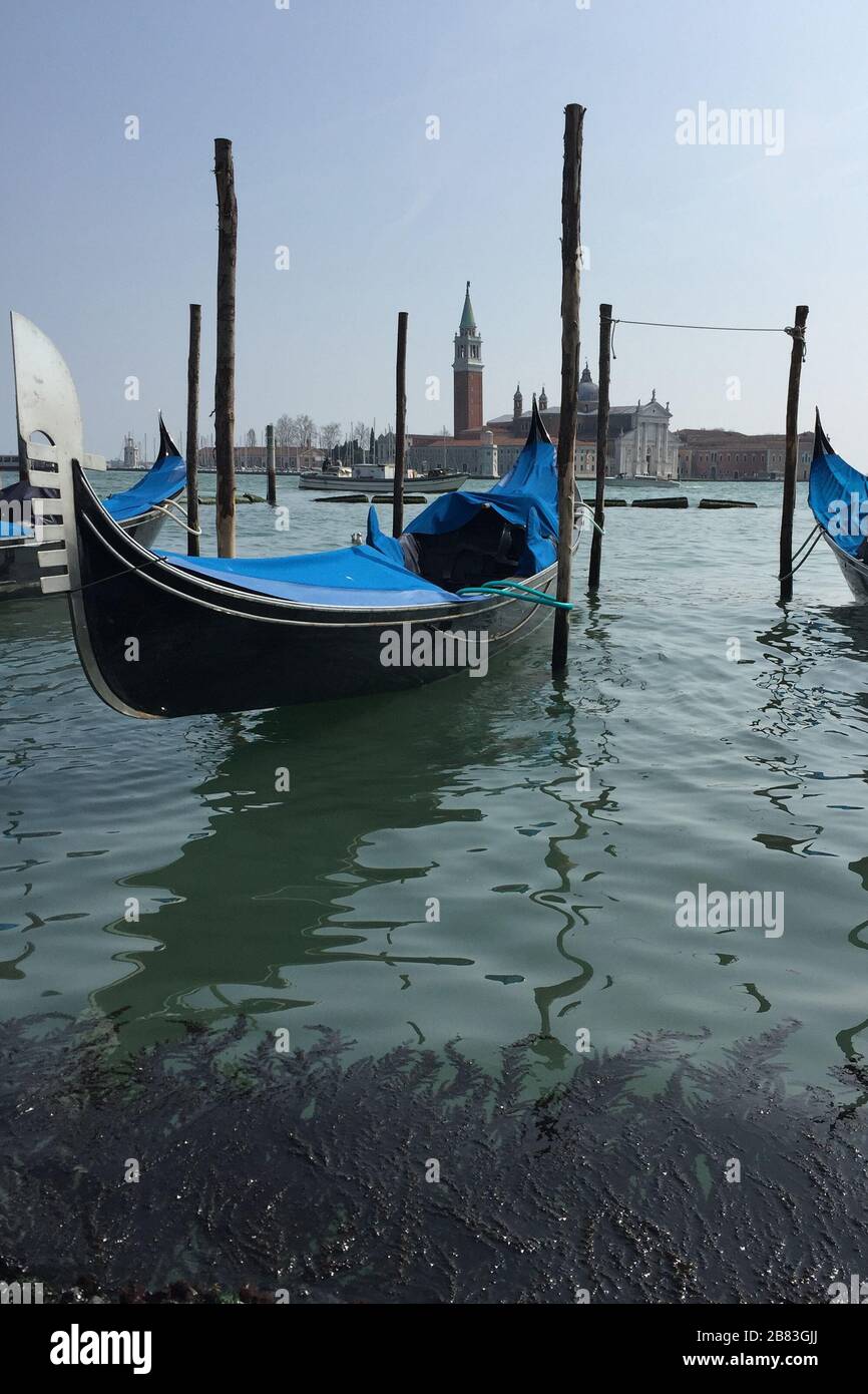 Venetian boats gondolas in harbor in Venice, Italy Stock Photo - Alamy