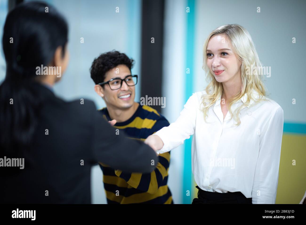 A group of business people are enjoying the success of doing business ...