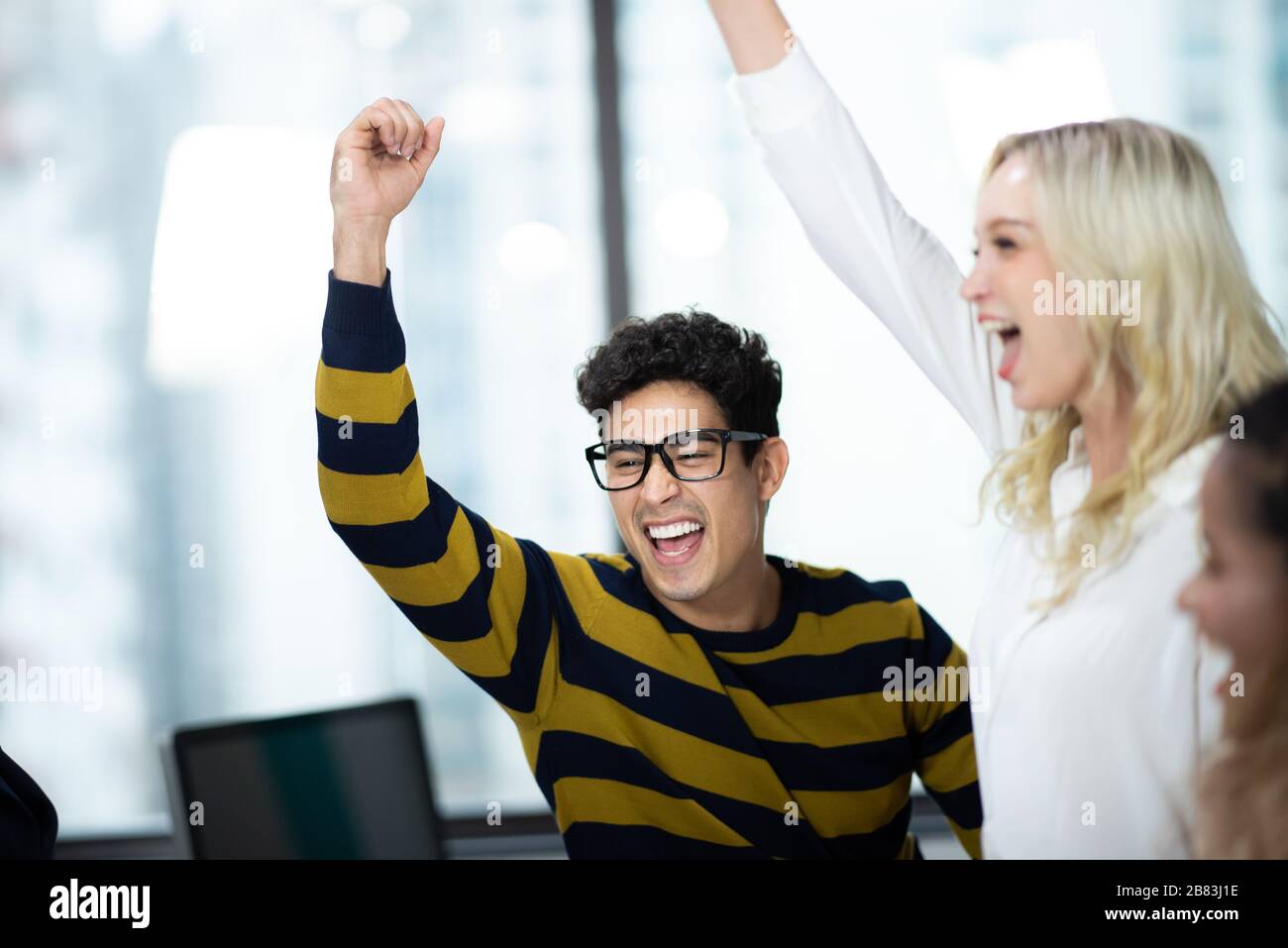 A group of business people are enjoying the success of doing business ...