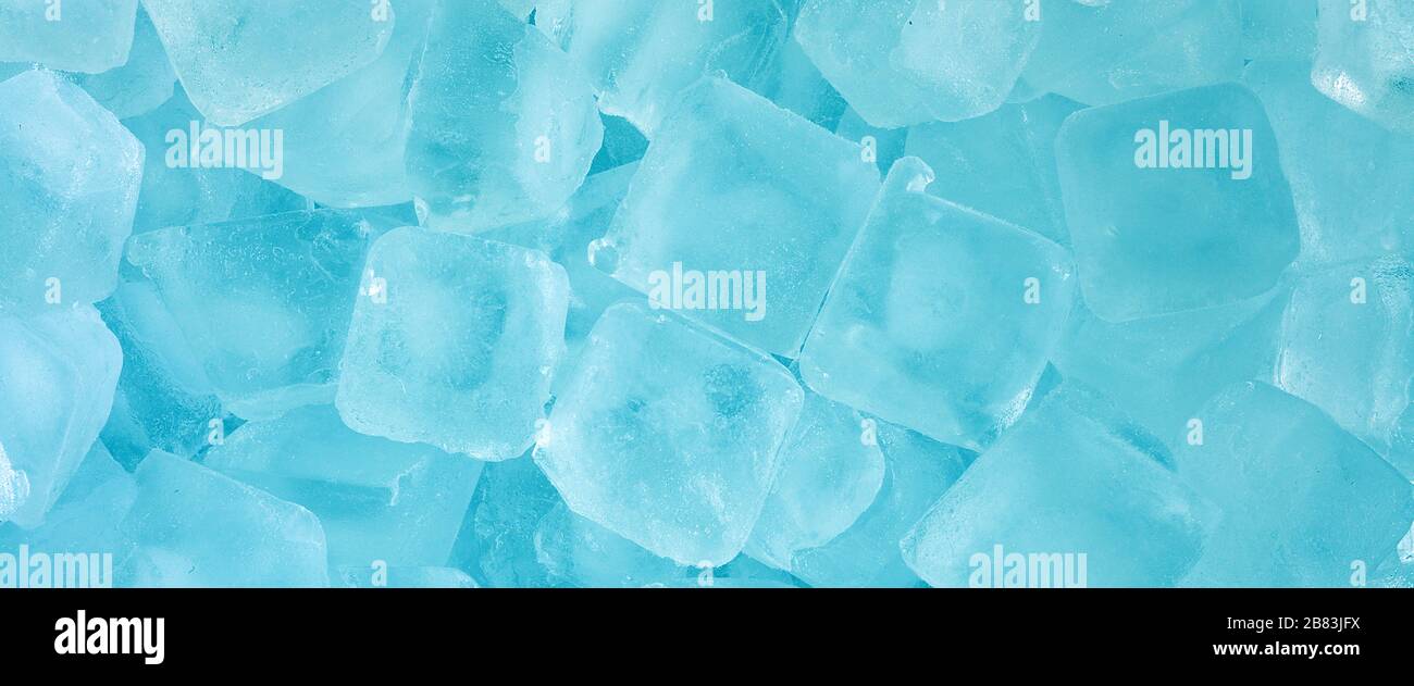 Freezing blue ice cubes Stock Photo - Alamy