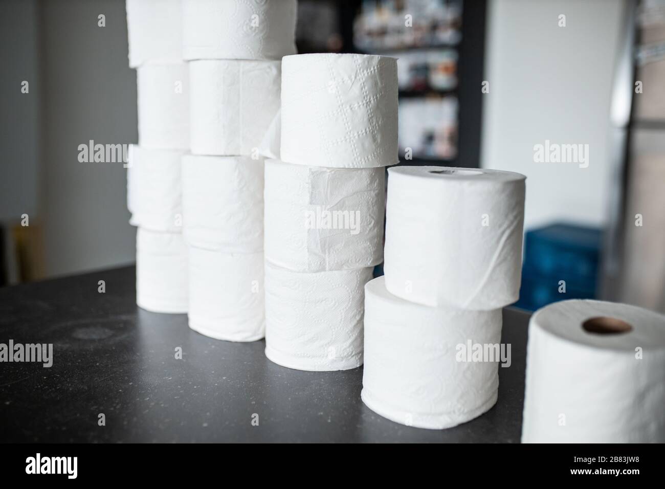 toilet paper bunched up together on a counter in a home Stock Photo - Alamy