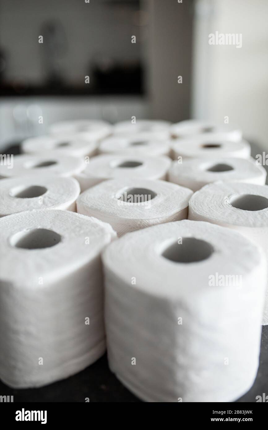 toilet paper bunched up together on a counter in a home Stock Photo - Alamy