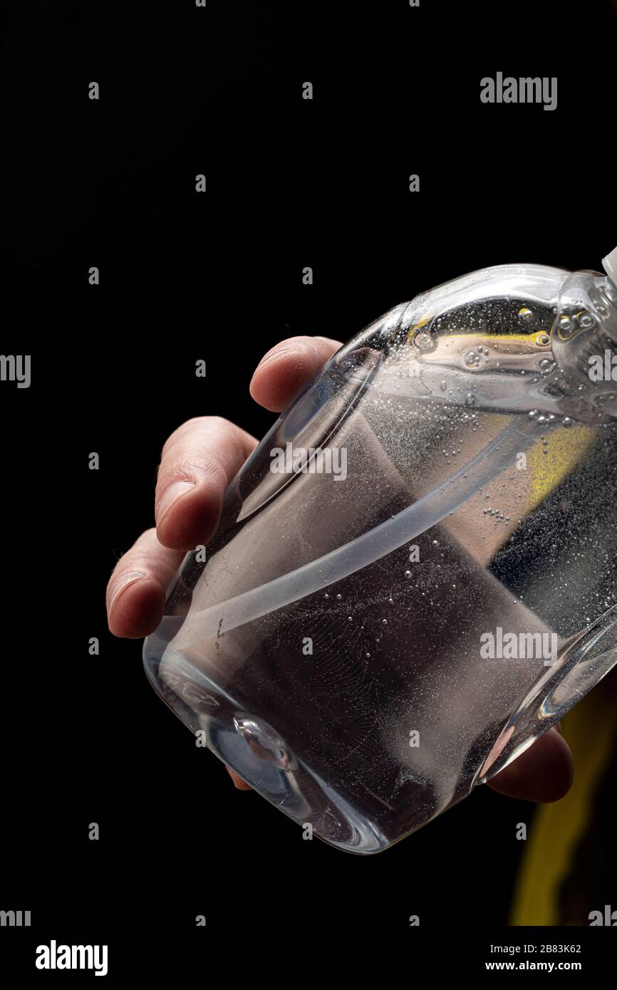 Young man is holding taking giving throwing a soap bottle for washing ...