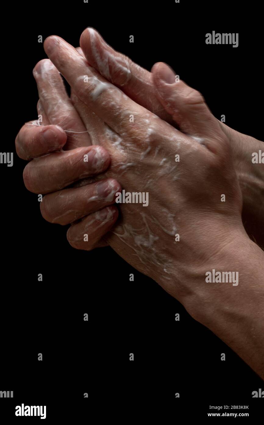 Young man is holding taking giving throwing a soap bottle for washing ...