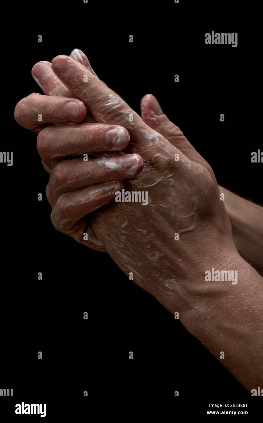 Young man is holding taking giving throwing a soap bottle for washing ...