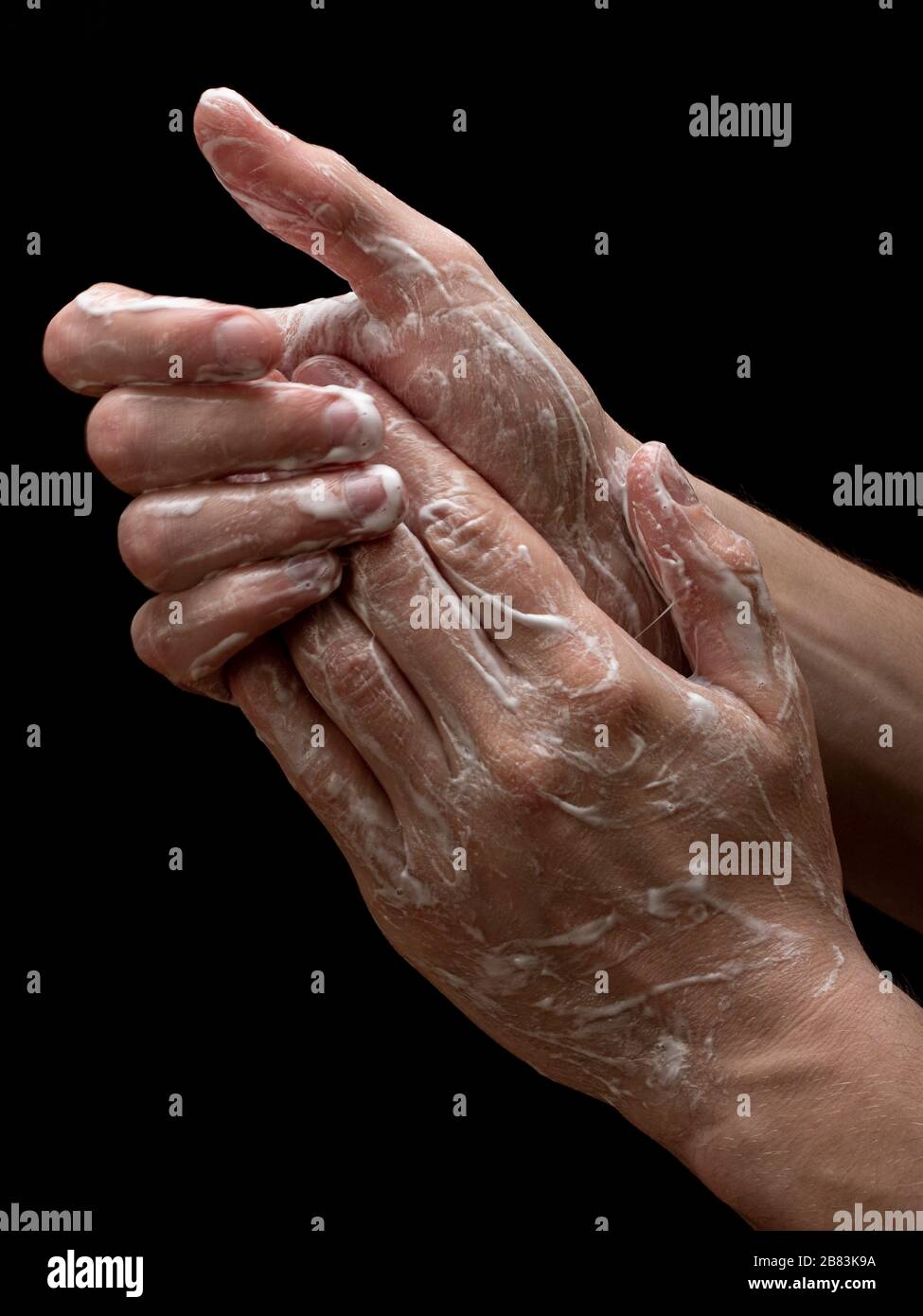 Young man is holding taking giving throwing a soap bottle for washing ...