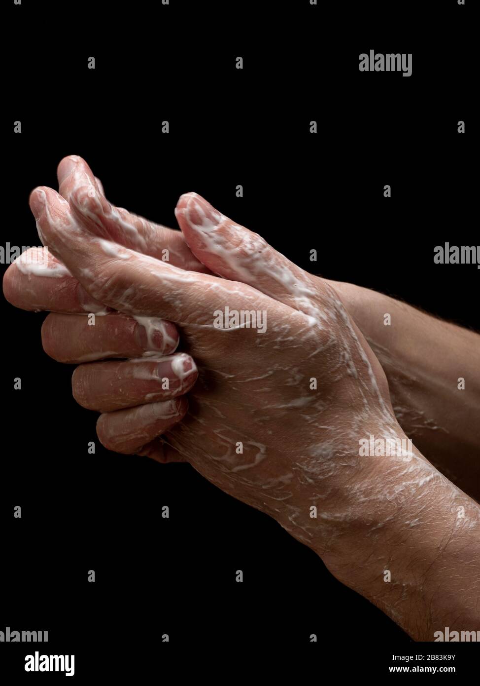 Young man is holding taking giving throwing a soap bottle for washing ...