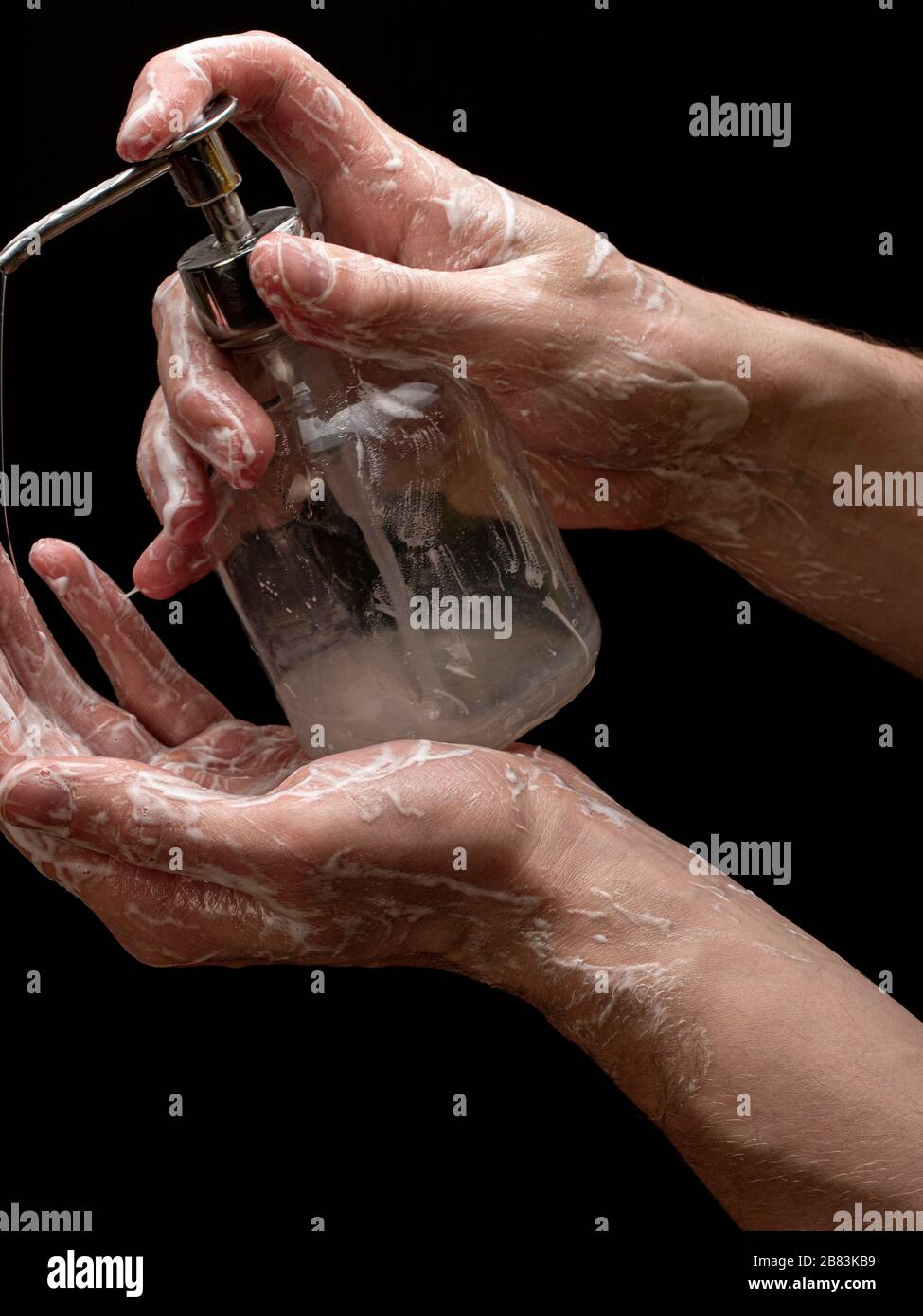 Young man is holding taking giving throwing a soap bottle for washing ...