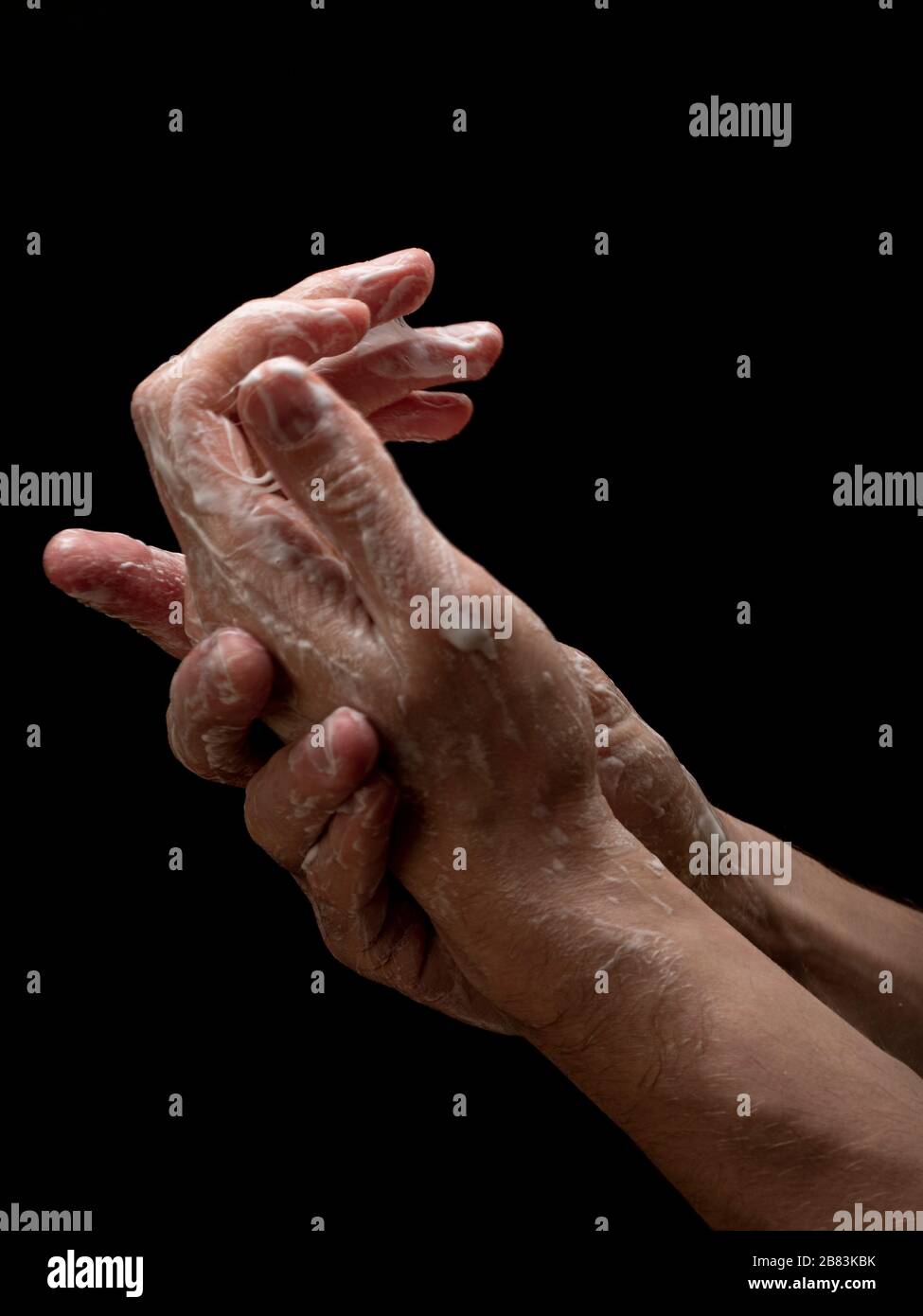 Young man is holding taking giving throwing a soap bottle for washing ...