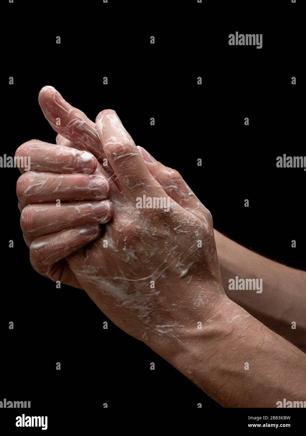 Young man is holding taking giving throwing a soap bottle for washing ...