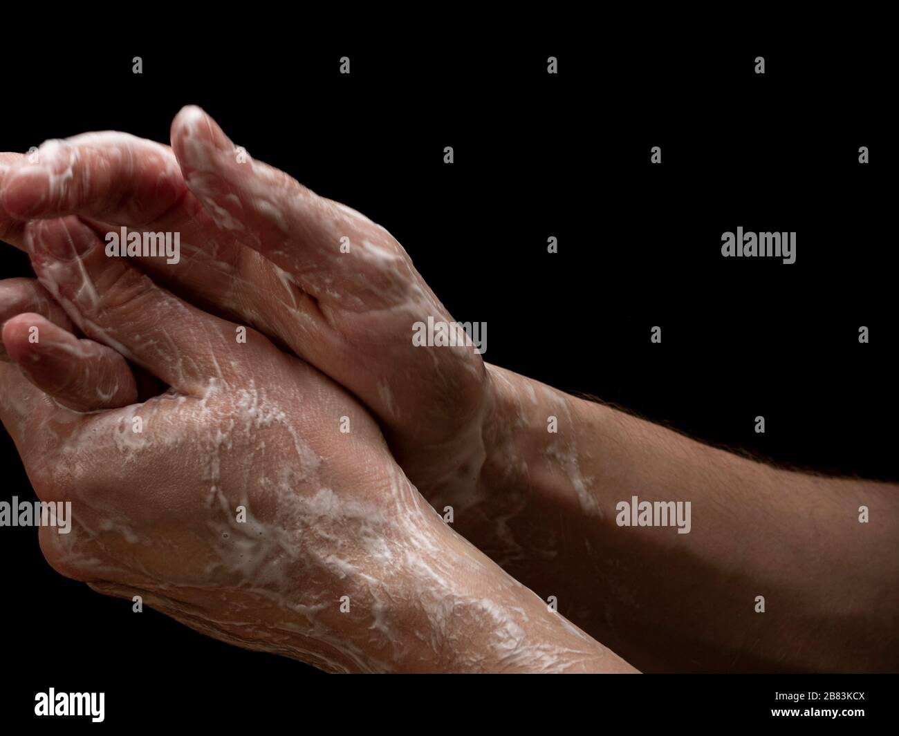 Young man is holding taking giving throwing a soap bottle for washing ...