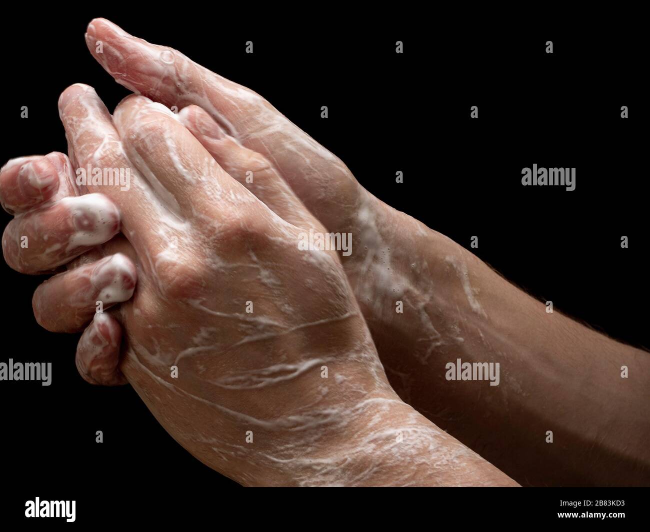 Young man is holding taking giving throwing a soap bottle for washing ...