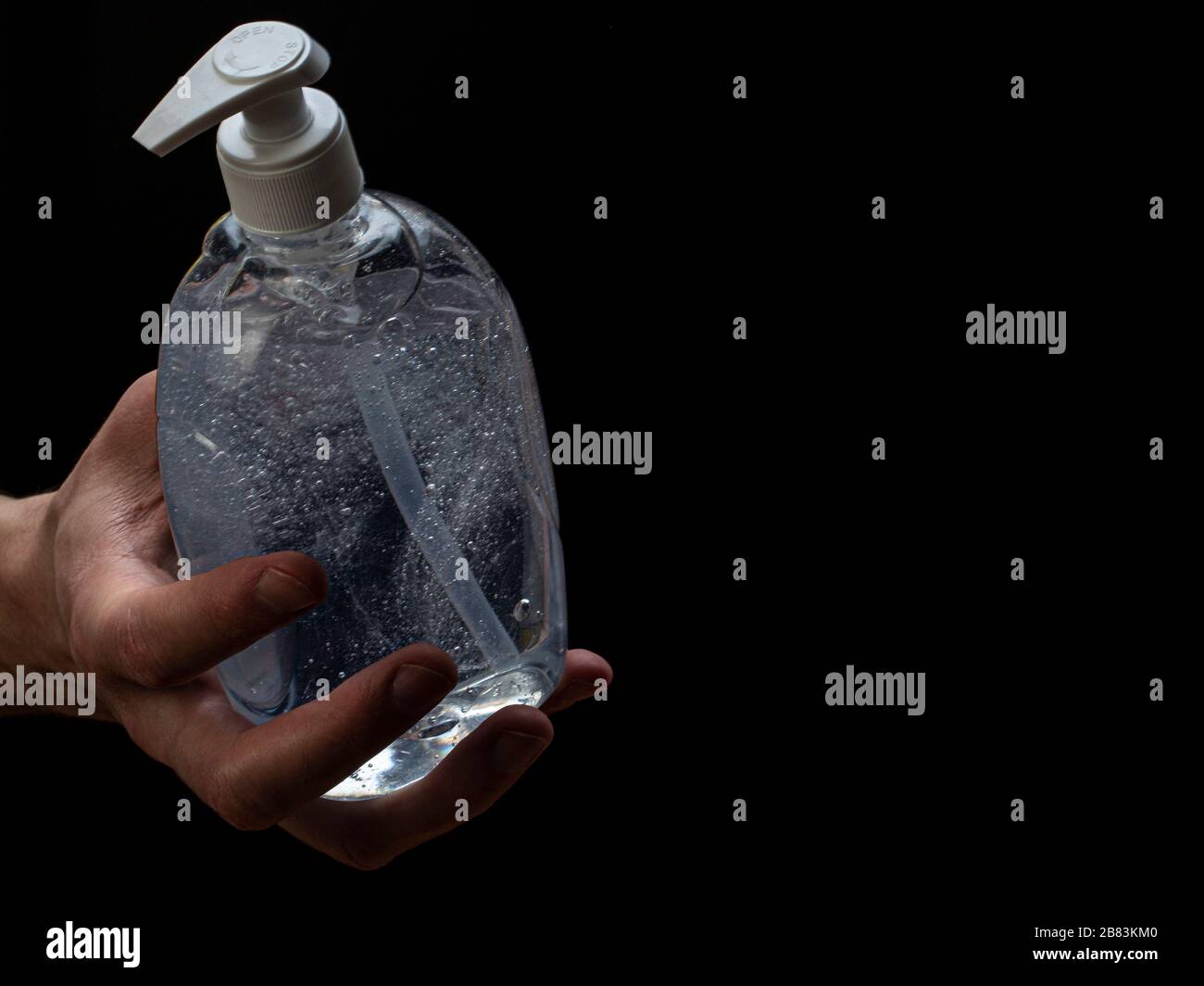 Young man is holding taking giving throwing a soap bottle for washing ...