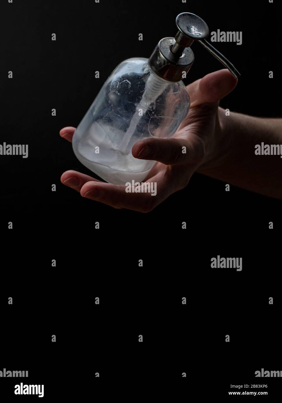 Young man is holding taking giving throwing a soap bottle for washing ...