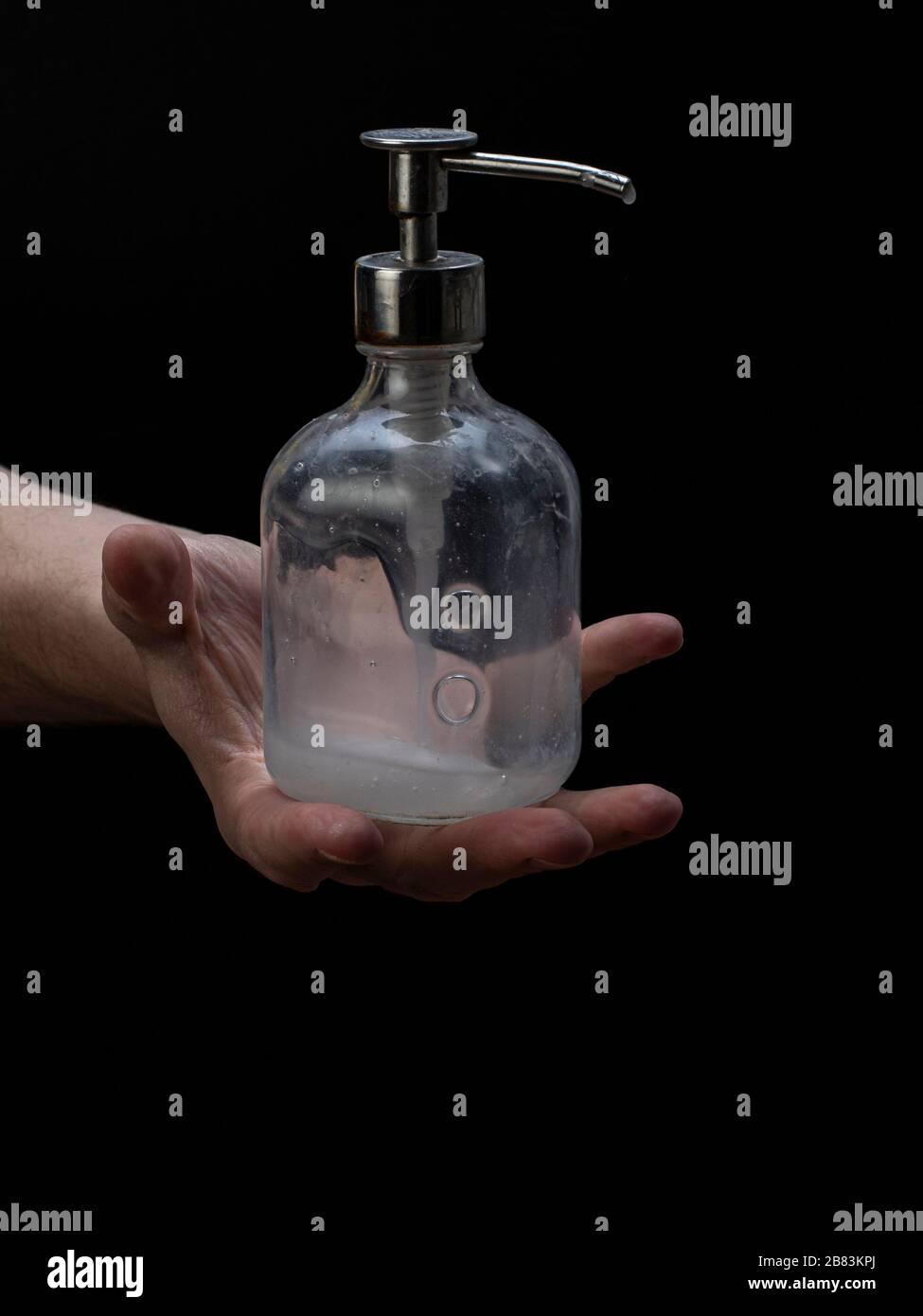 Young man is holding taking giving throwing a soap bottle for washing ...
