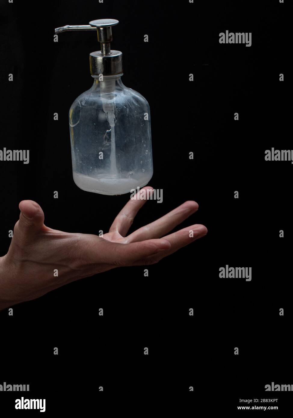 Young man is holding taking giving throwing a soap bottle for washing ...