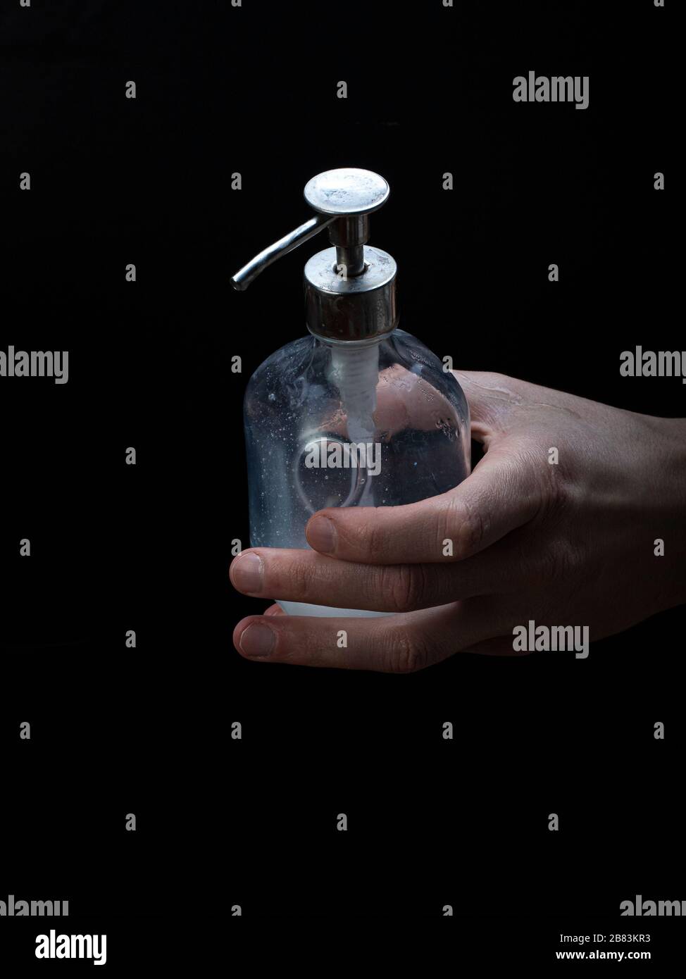 Young man is holding taking giving throwing a soap bottle for washing ...