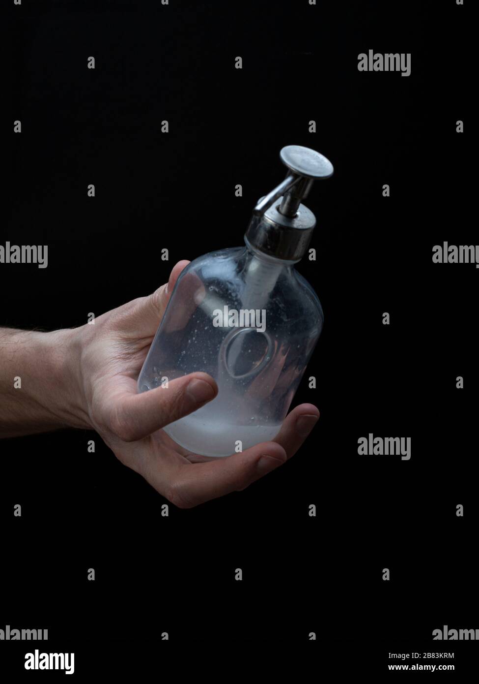 Young man is holding taking giving throwing a soap bottle for washing ...