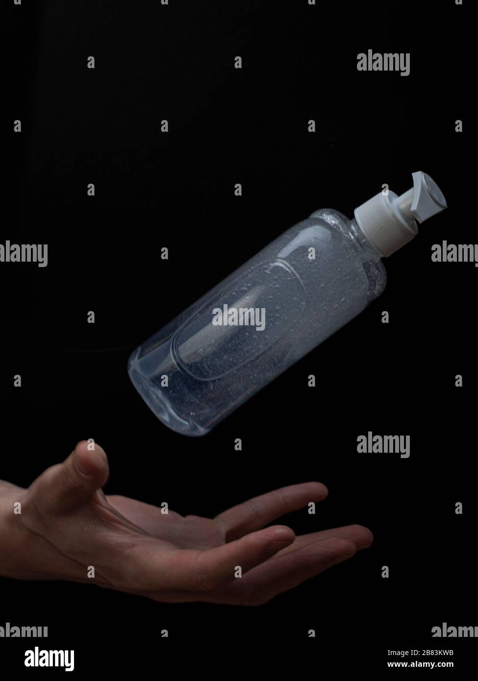 Young man is holding taking giving throwing a soap bottle for washing ...