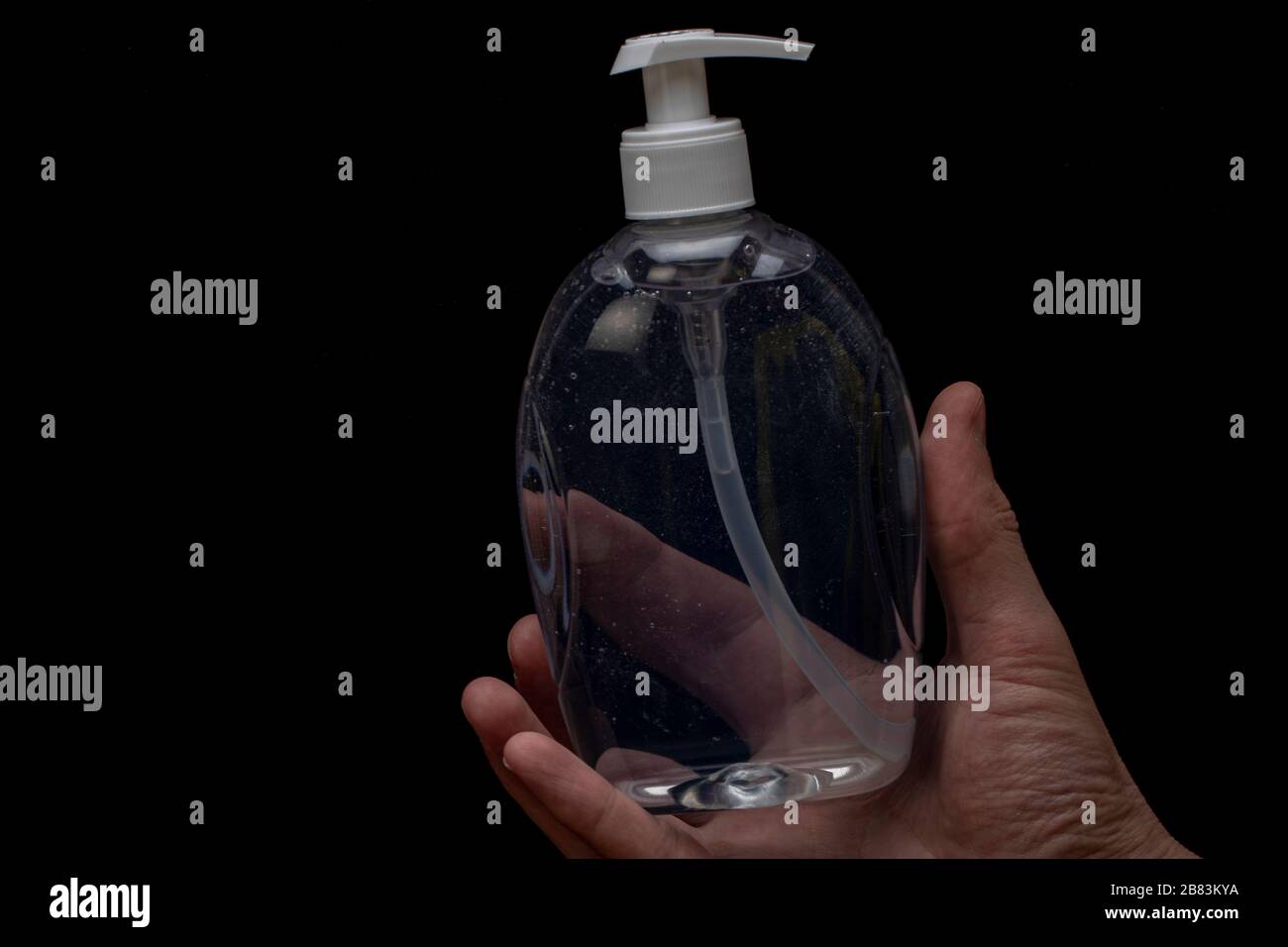 Young man is holding taking giving throwing a soap bottle for washing ...