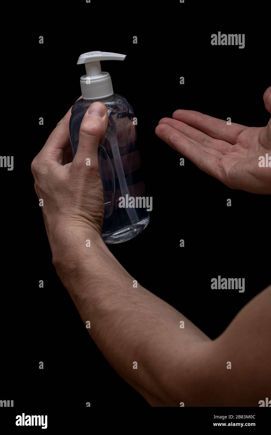 Young man is holding taking giving throwing a soap bottle for washing ...