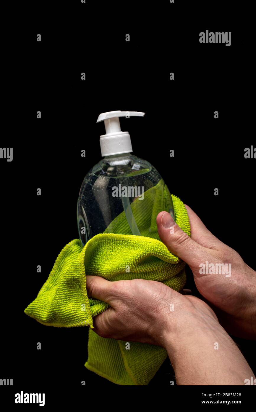 Young man is holding taking giving throwing a soap bottle for washing ...