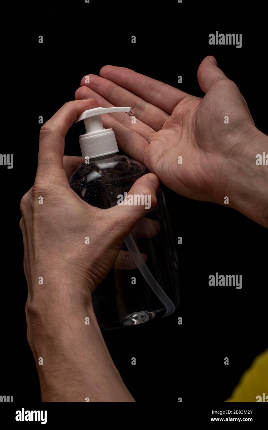 Young man is holding taking giving throwing a soap bottle for washing ...