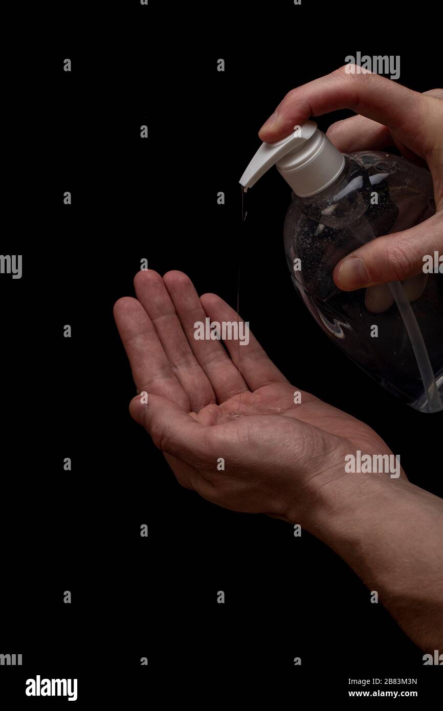 Young man is holding taking giving throwing a soap bottle for washing ...