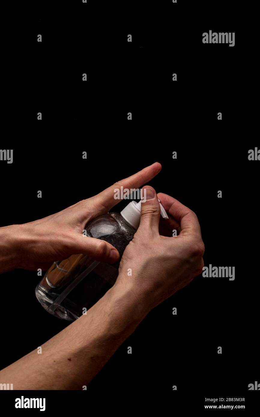 Young man is holding taking giving throwing a soap bottle for washing ...